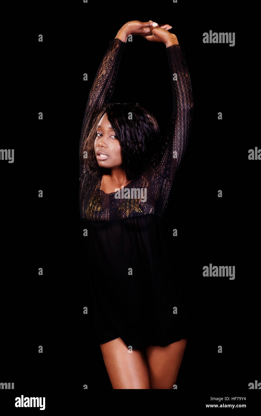 Attractive African American Woman In Black Nightie On Dark Background ...