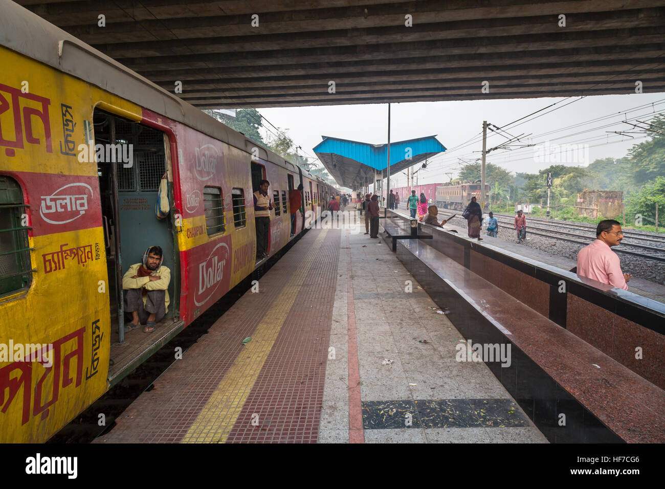 Local passenger train of the Indian railways standing at a railway ...