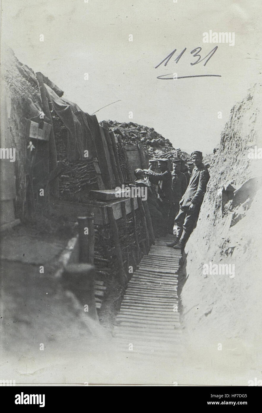 A photo of a German Army barber shaving soldiers on a Sunday morning in ...