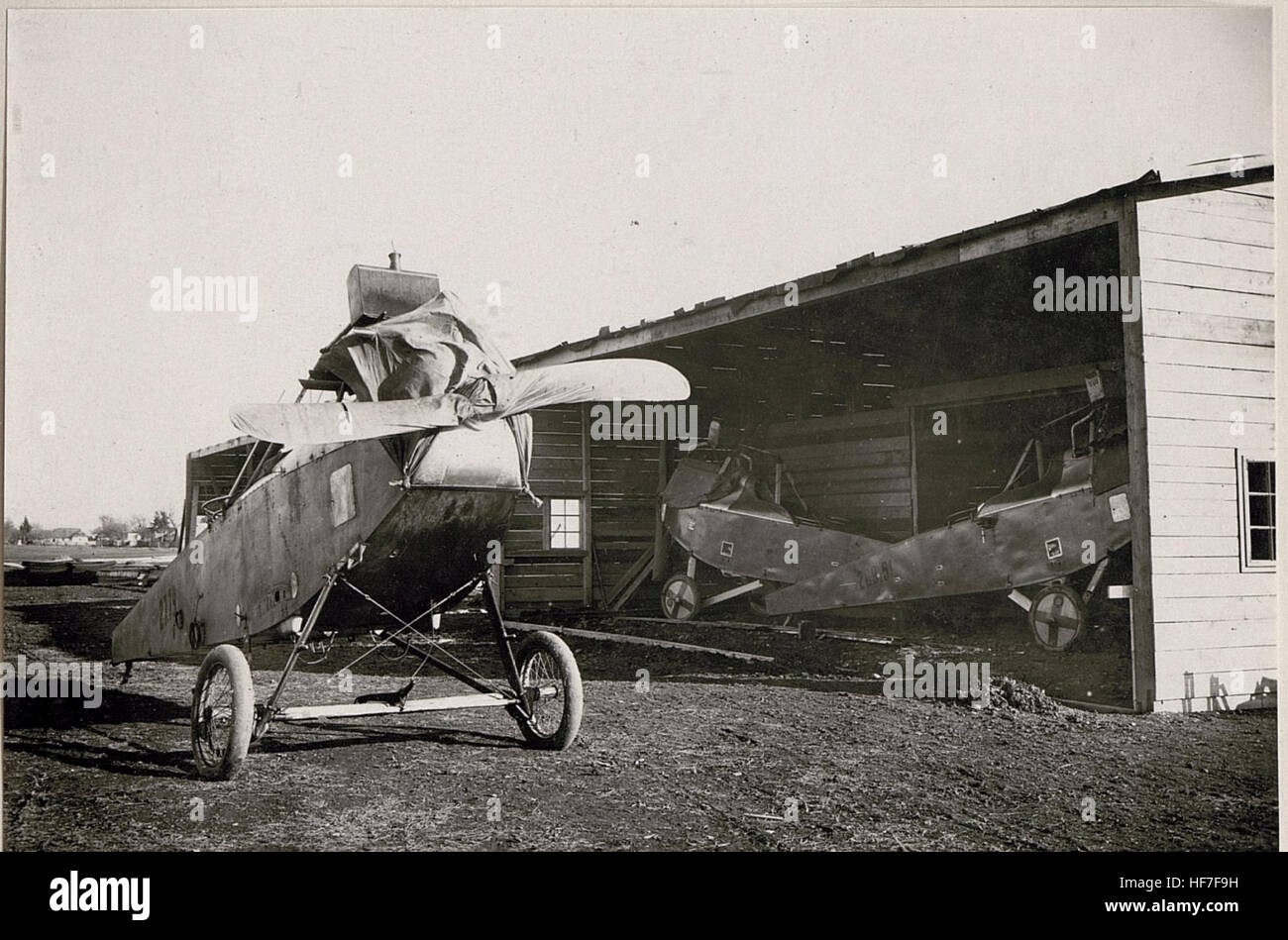 This photograph from World War I depicts aircraft destroyed in a storm ...