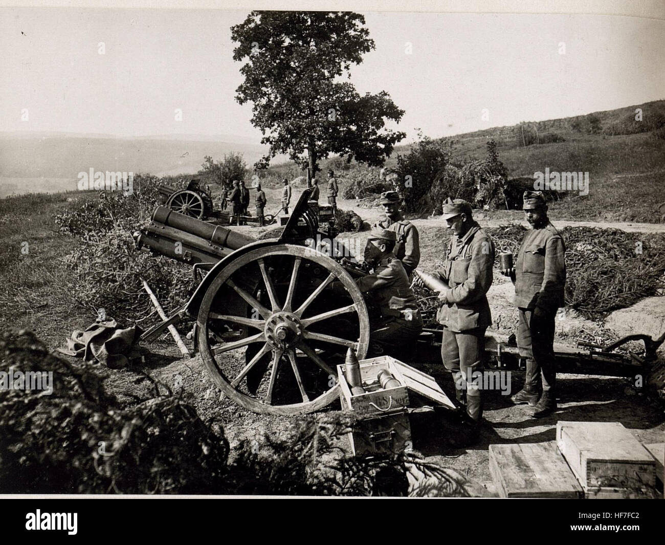 This image from World War I features a 10 cm Feldhaubitze (howitzer) in ...