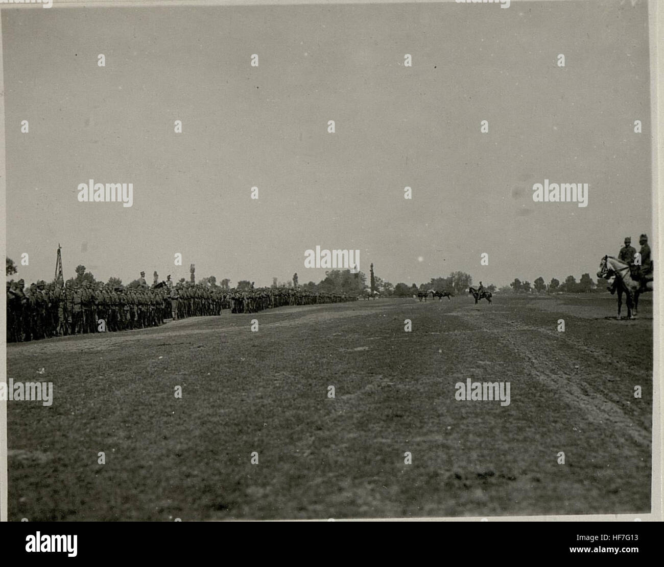 This photograph depicts a military parade during World War I, showing ...