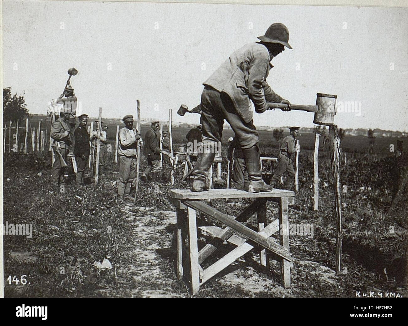 This World War I photograph depicts Russian soldiers setting up wire ...