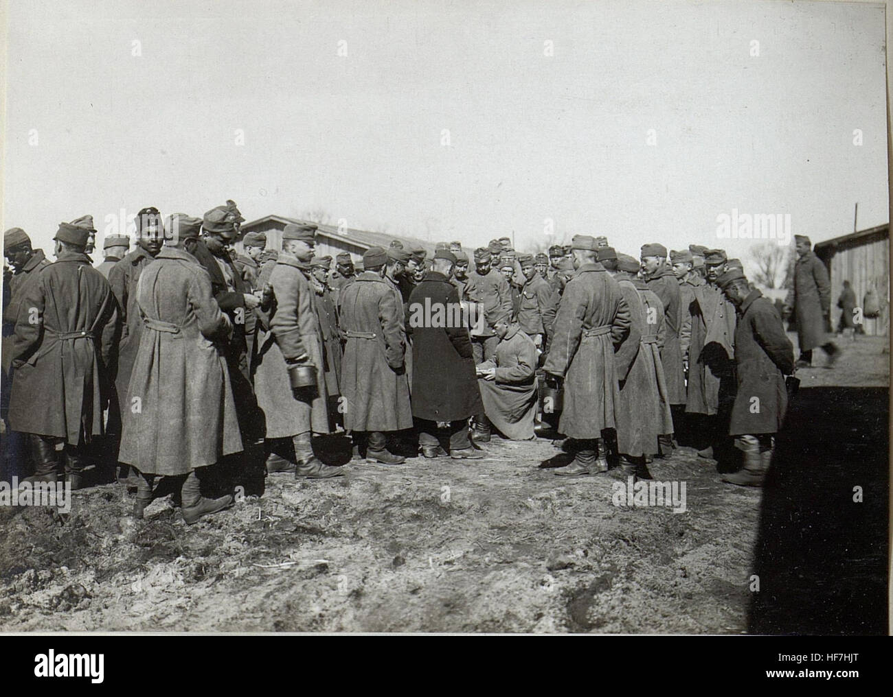 This historical image depicts prisoners of war and soldiers returning ...