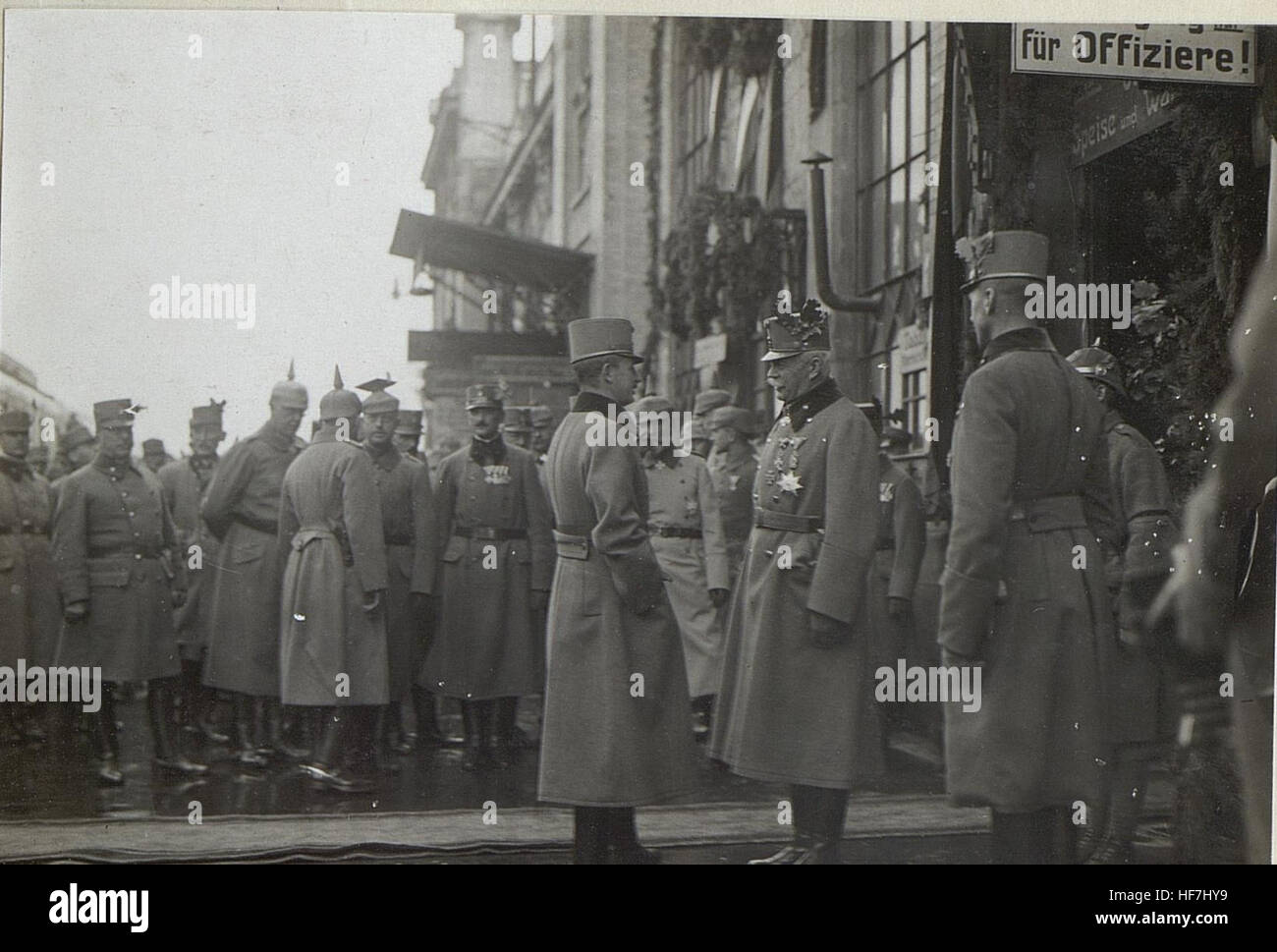 This historical image depicts visits by high-ranking officers and ...