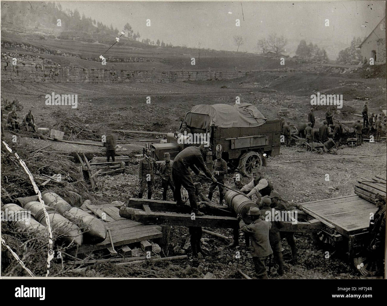 This image depicts the assembly of a 42 cm howitzer during World War I ...