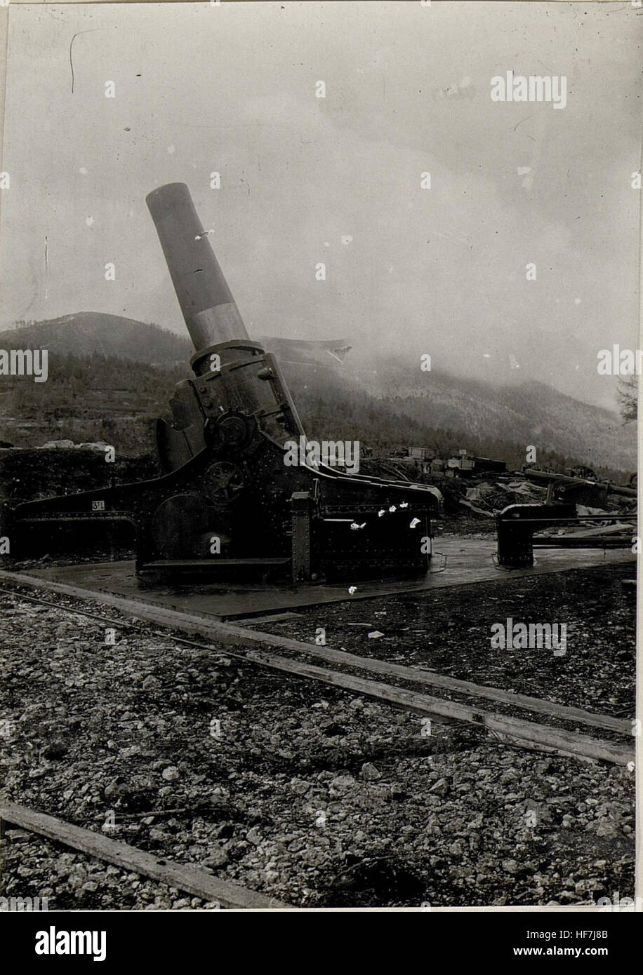 This photograph from World War I shows the assembly of a 42 cm howitzer ...