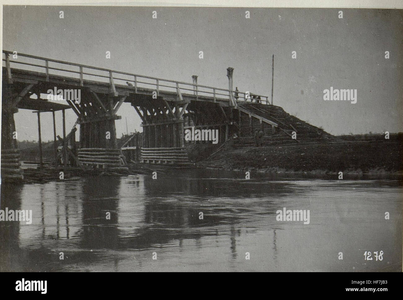 This historical image depicts bridge construction in Galicia during the ...