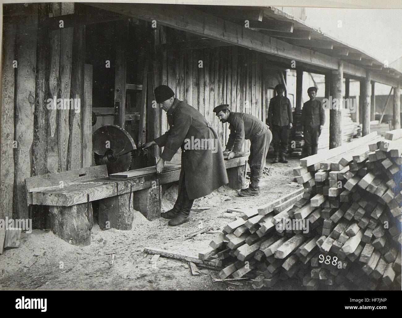 This photograph depicts wood processing in the wintery landscapes of ...