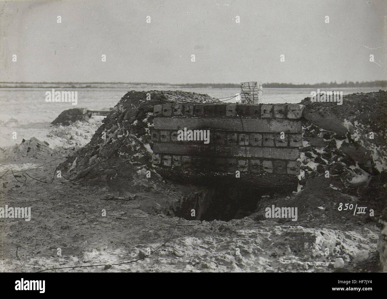 This historical photograph captures explosive tests conducted on the ...