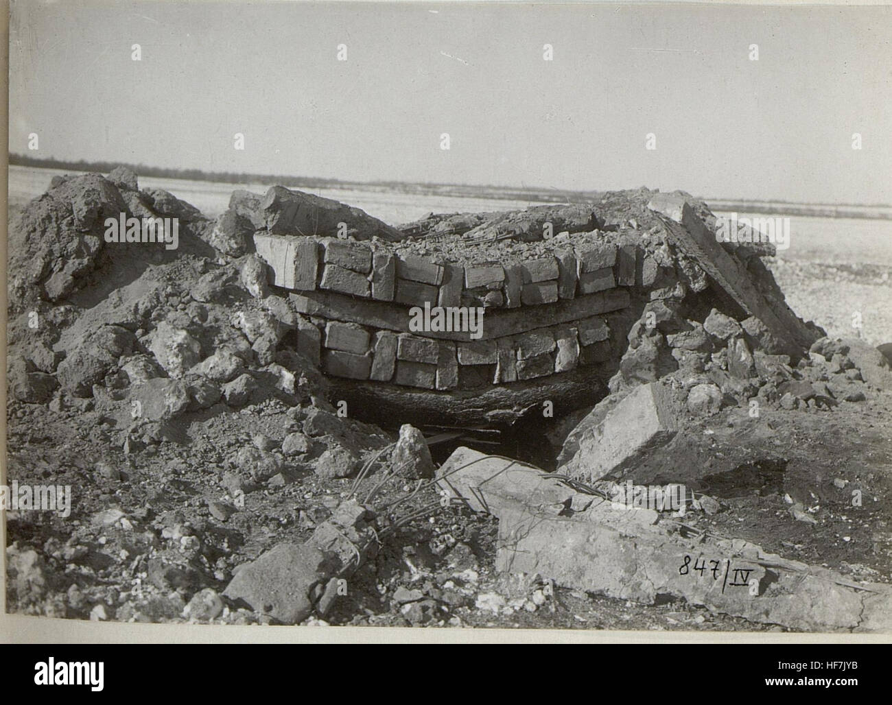 This historical photograph, taken during World War I, shows explosive ...