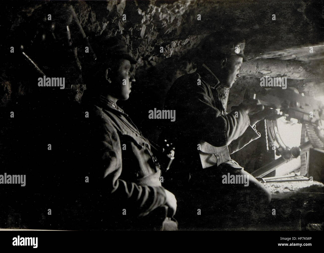 A historical image from World War I showing a machine gun emplacement ...