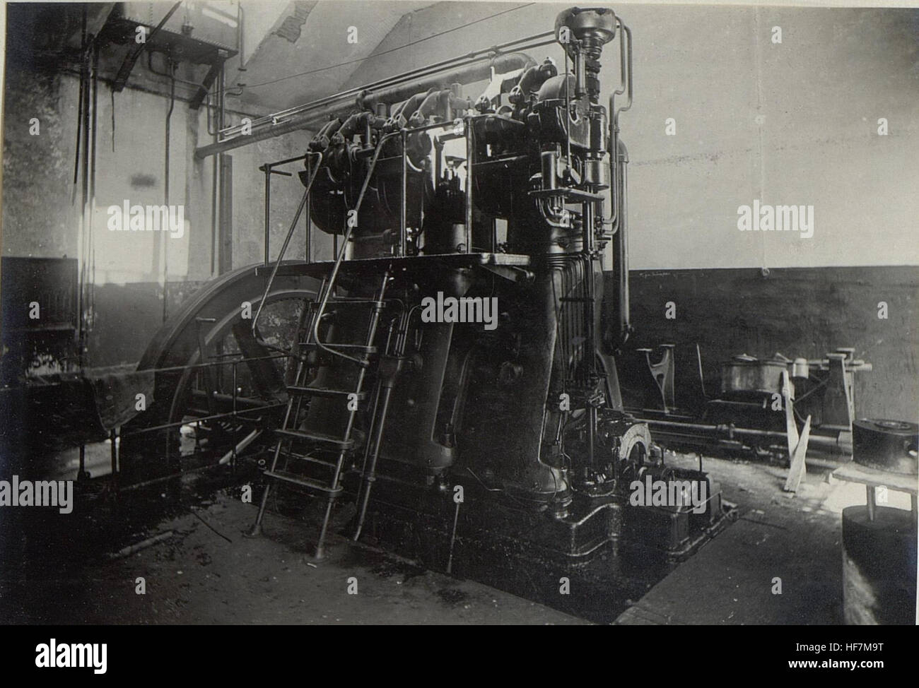 This image depicts a diesel engine used in a cotton spinning mill ...
