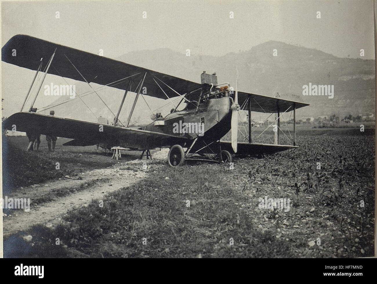 This image depicts a crashed Austrian aircraft from World War I, a ...