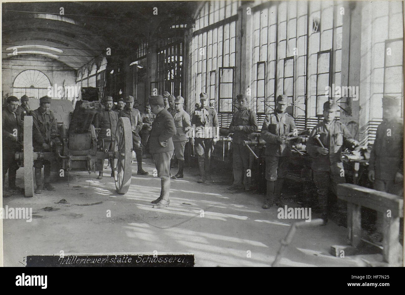 This image from World War I depicts an artillery workshop, showing the ...