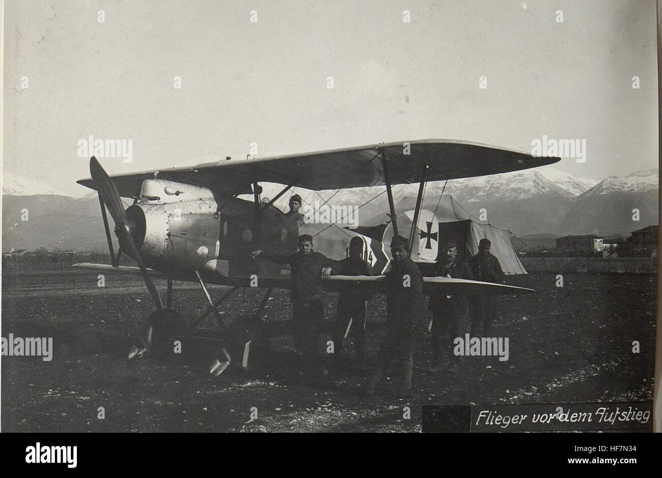This historical photograph depicts a German World War I aircraft, taken ...