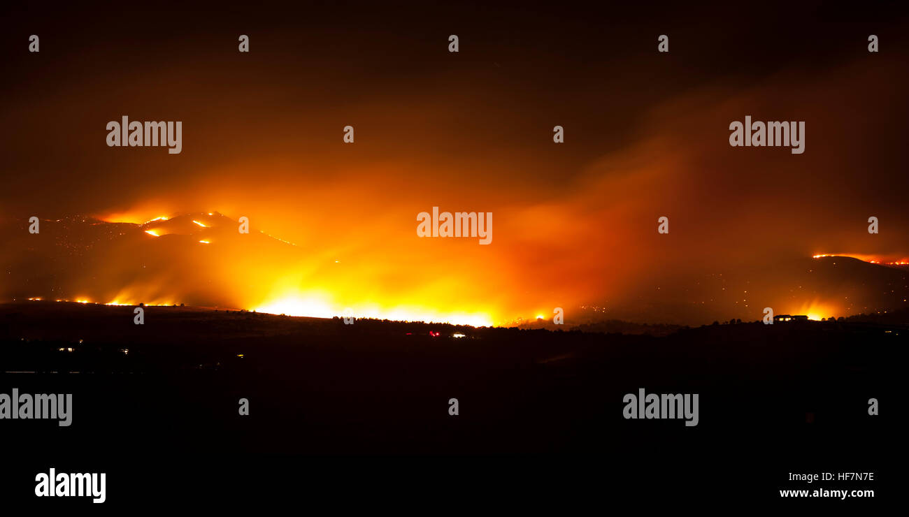 Wildfire burning at night in Northern Nevada with smoke and flames ...