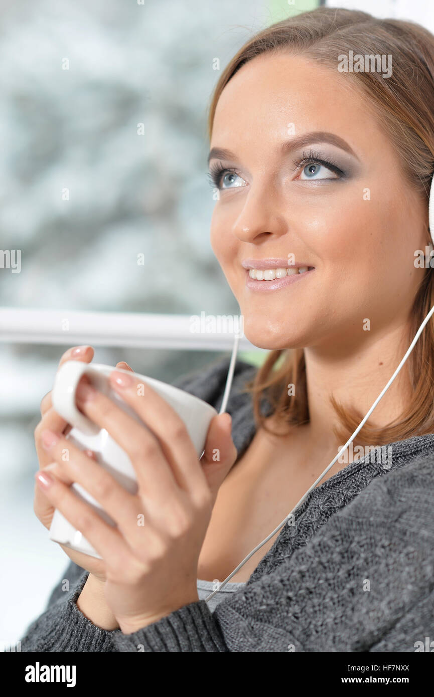 Girl drinking tea Stock Photo - Alamy