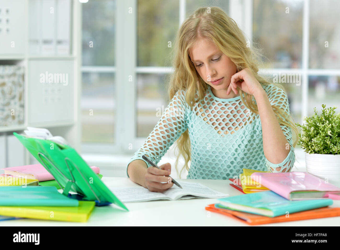 teenager girl doing homework Stock Photo - Alamy