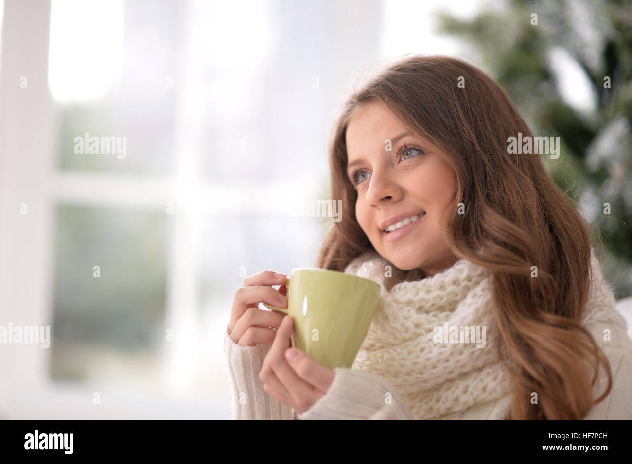 Girl drinking tea Stock Photo - Alamy