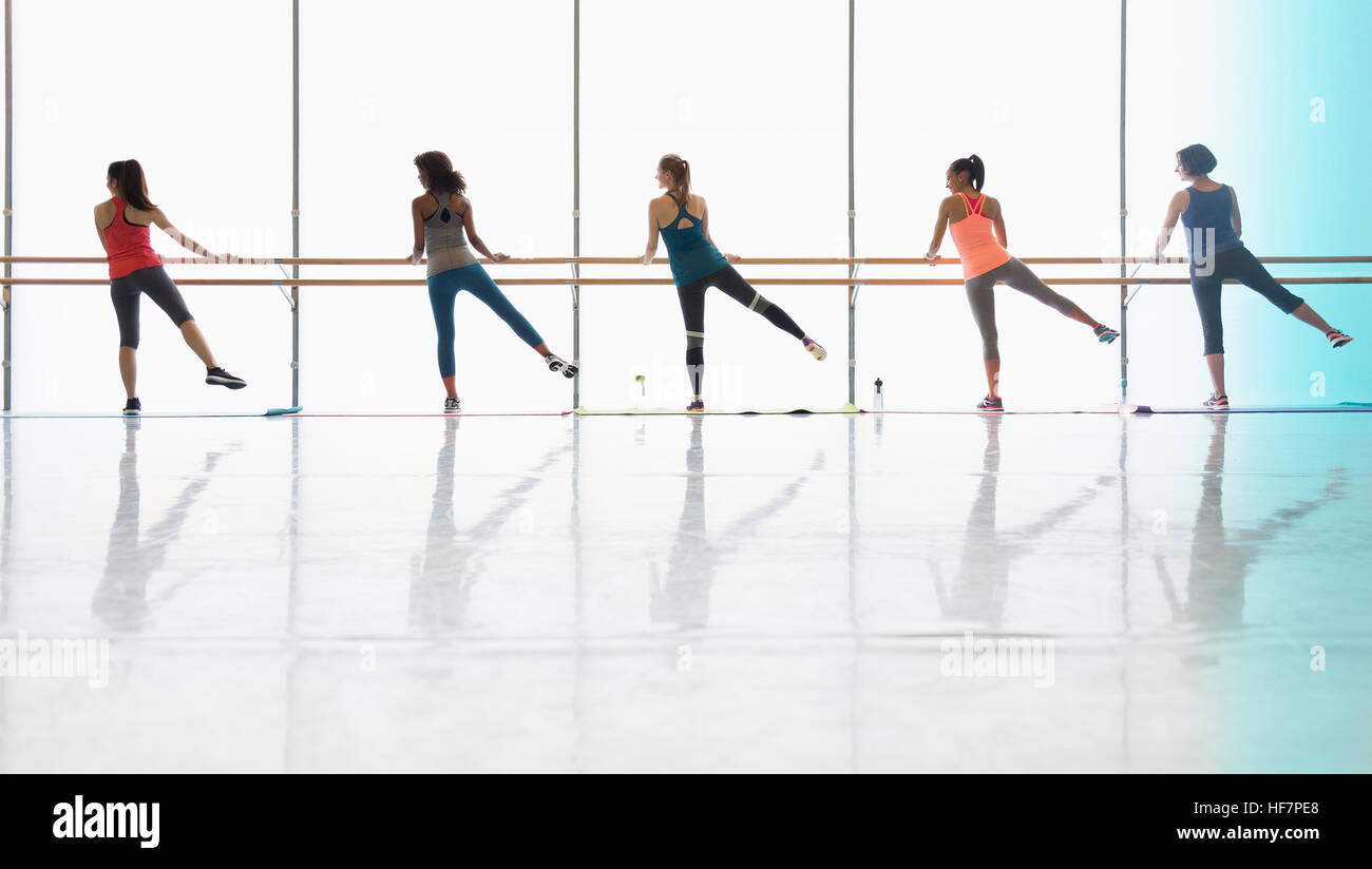 Women exercising at barre in exercise class gym studio Stock Photo - Alamy