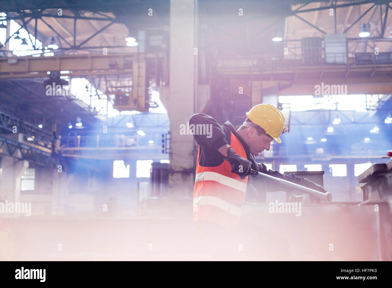 Steel worker working in factory Stock Photo - Alamy