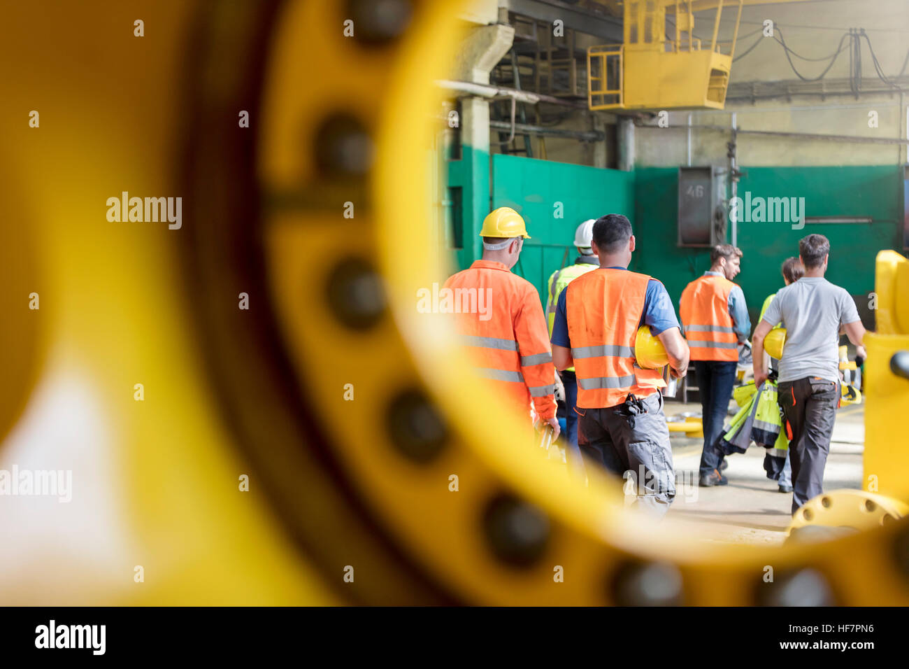 Steel workers walking in factory Stock Photo - Alamy