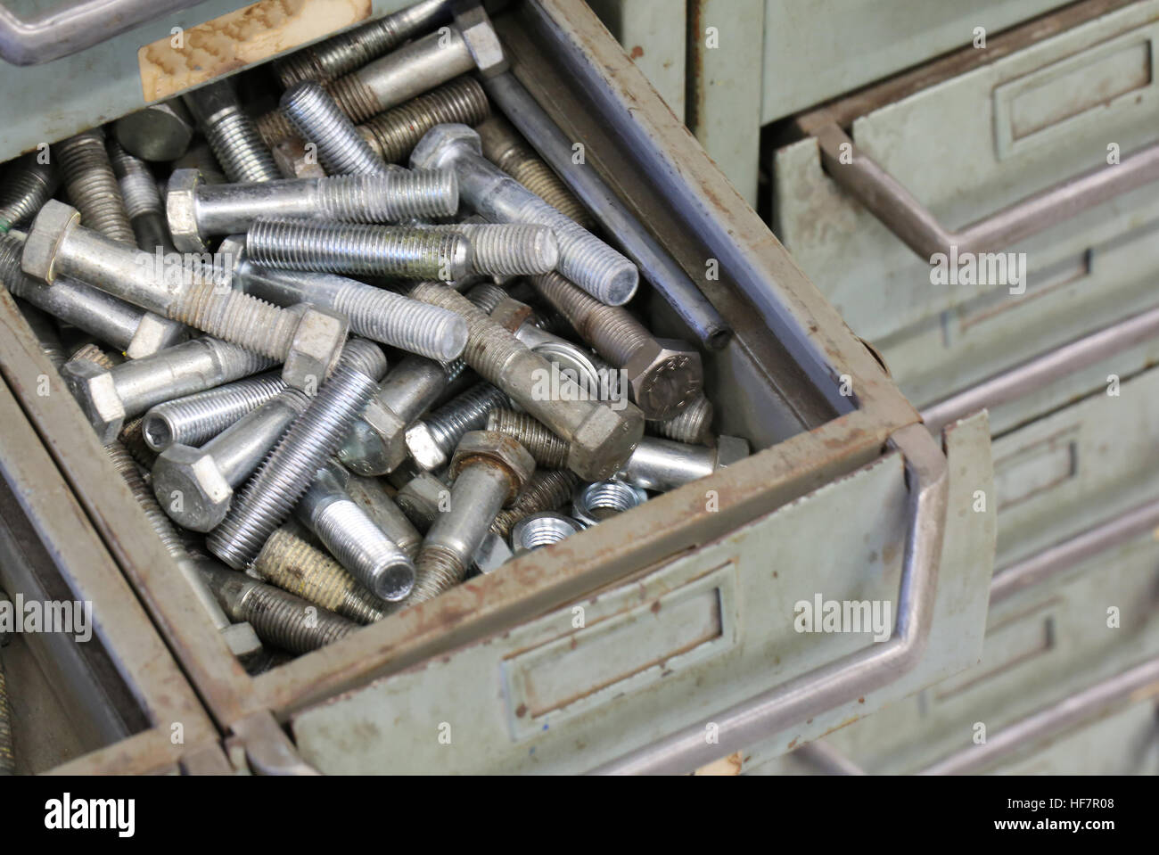 many iron bolts in a drawer in the old hardware store Stock Photo - Alamy
