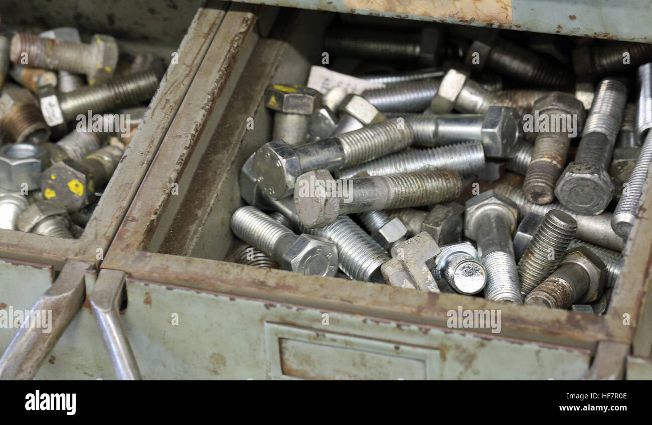 many iron bolts in a drawer in the vintage hardware store Stock Photo ...