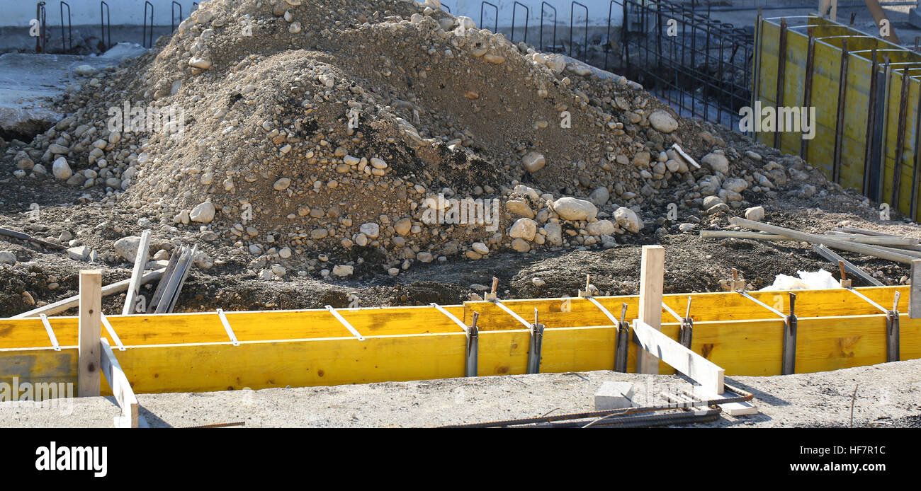 pile of earth and delimitation of outer walls of a house in ...