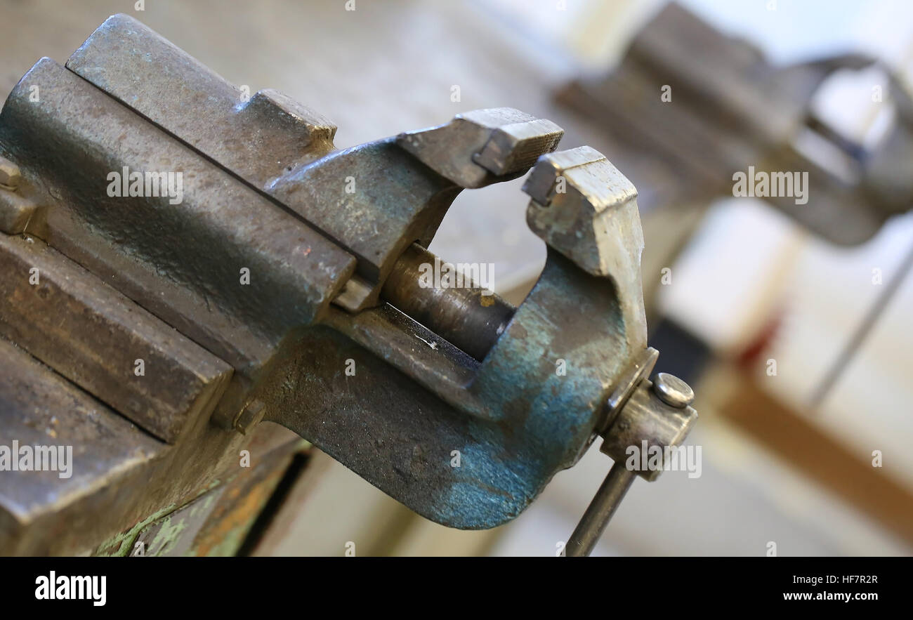 Internal workshop of a blacksmith and the big iron vise Stock Photo - Alamy