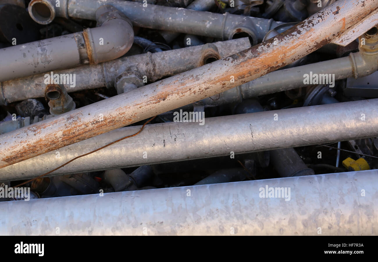 old iron pipes and other ferrous material in a landfill Stock Photo - Alamy