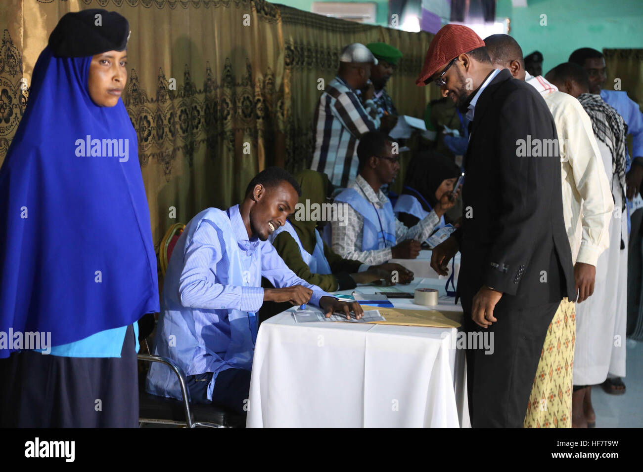 Electoral official stamps on the ballot paper during the electoral ...