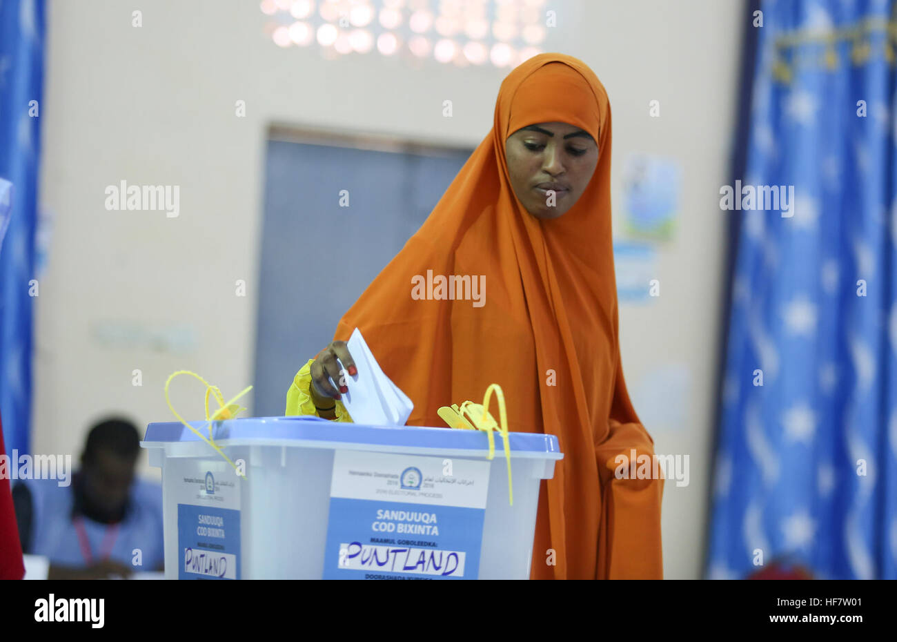 A delegate casts her vote during the electoral process to choose ...