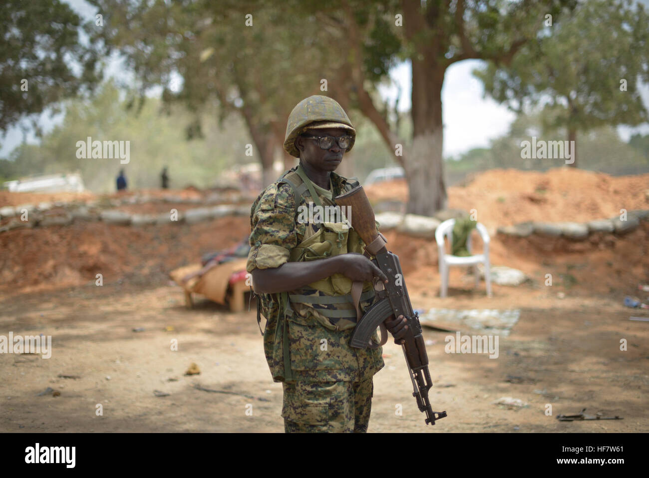 A Ugandan soldier from AMISOM stands guard at a police station in ...
