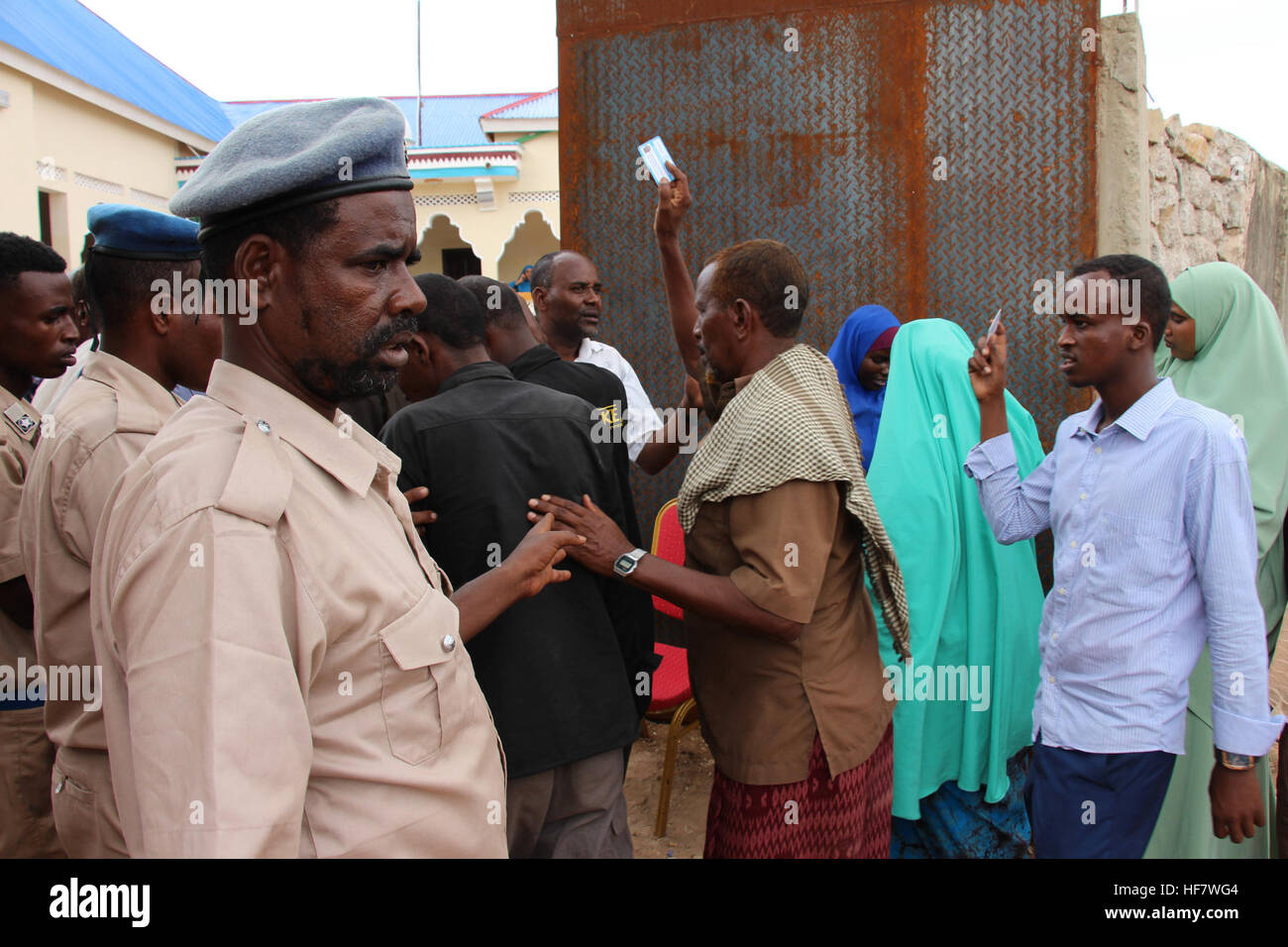 Somali Police Force (SPF), officers check delegate's identification ...