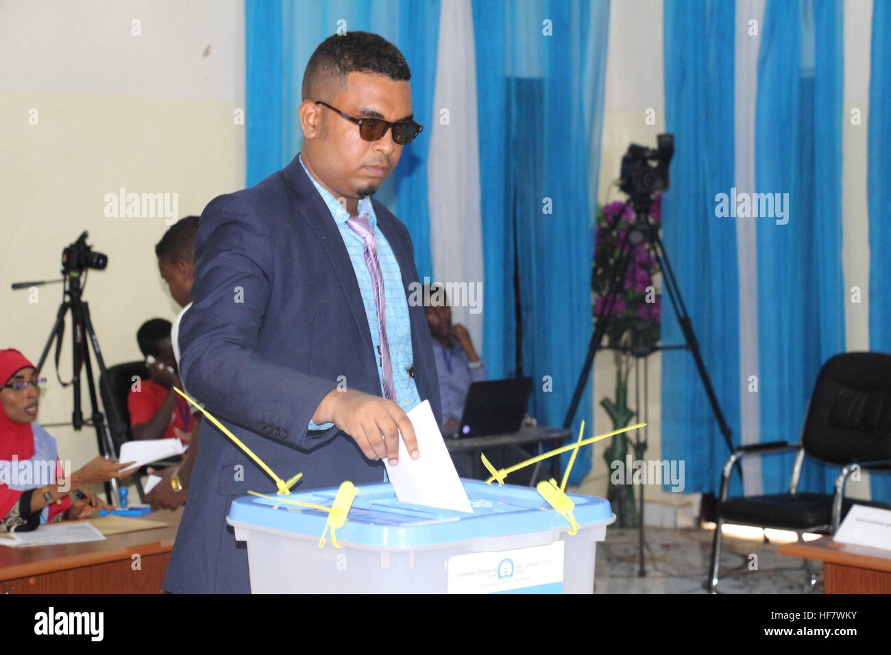 A delegate casts their vote during the electoral process for members of ...