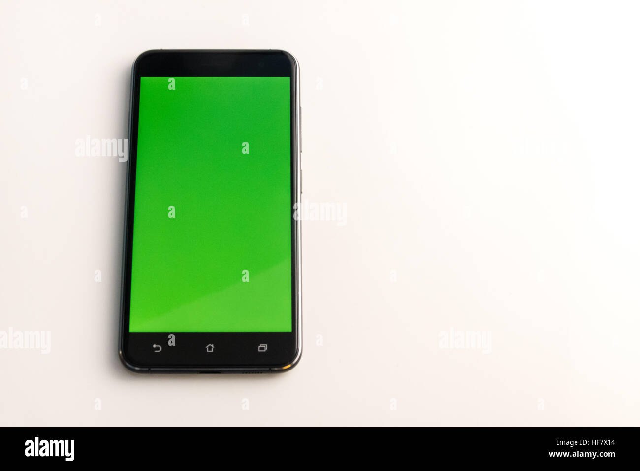 Smart phone with green screen on display isolated on white Stock Photo ...