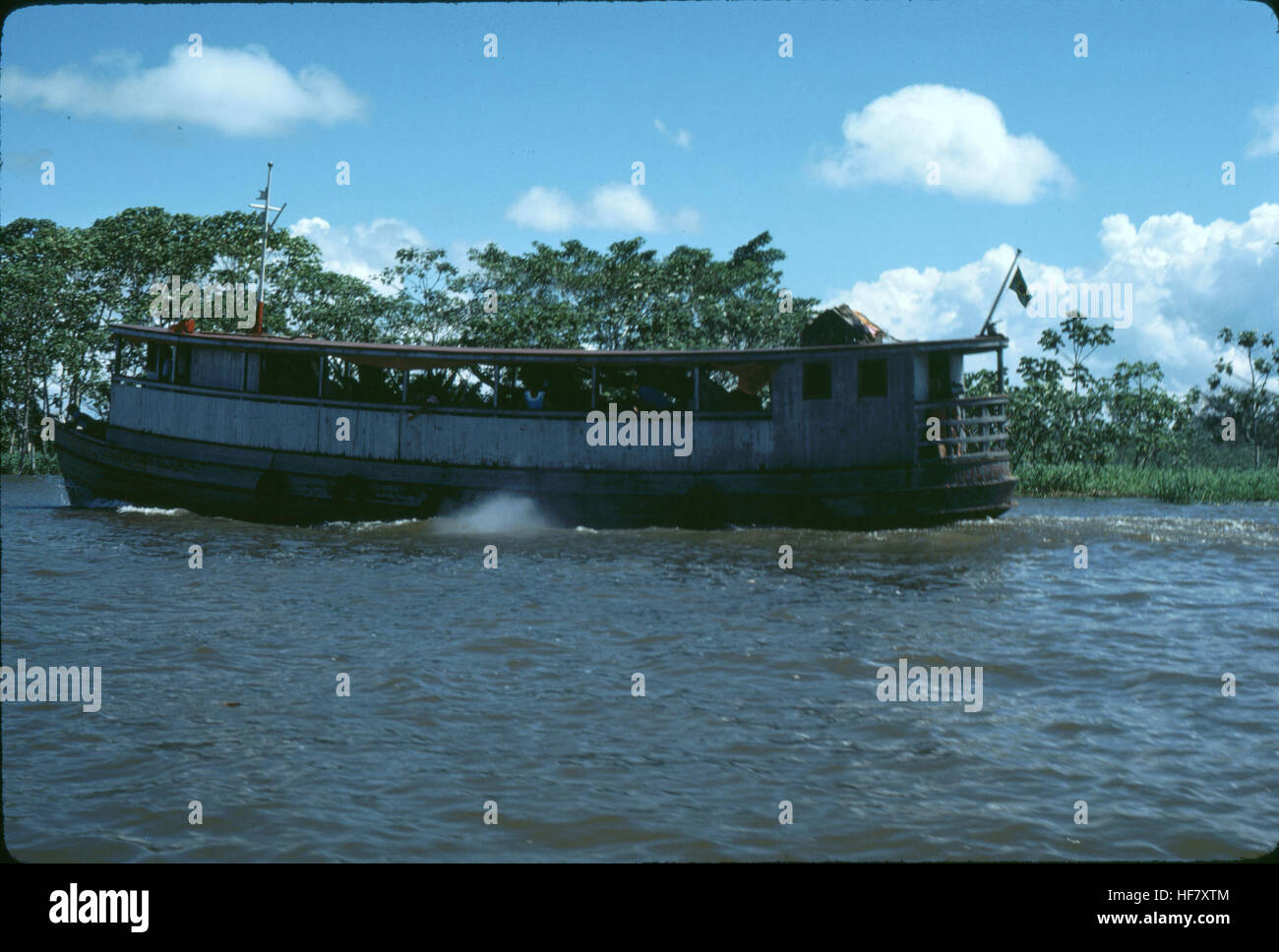 This image depicts an old passenger boat on the Amazon River in Brazil ...