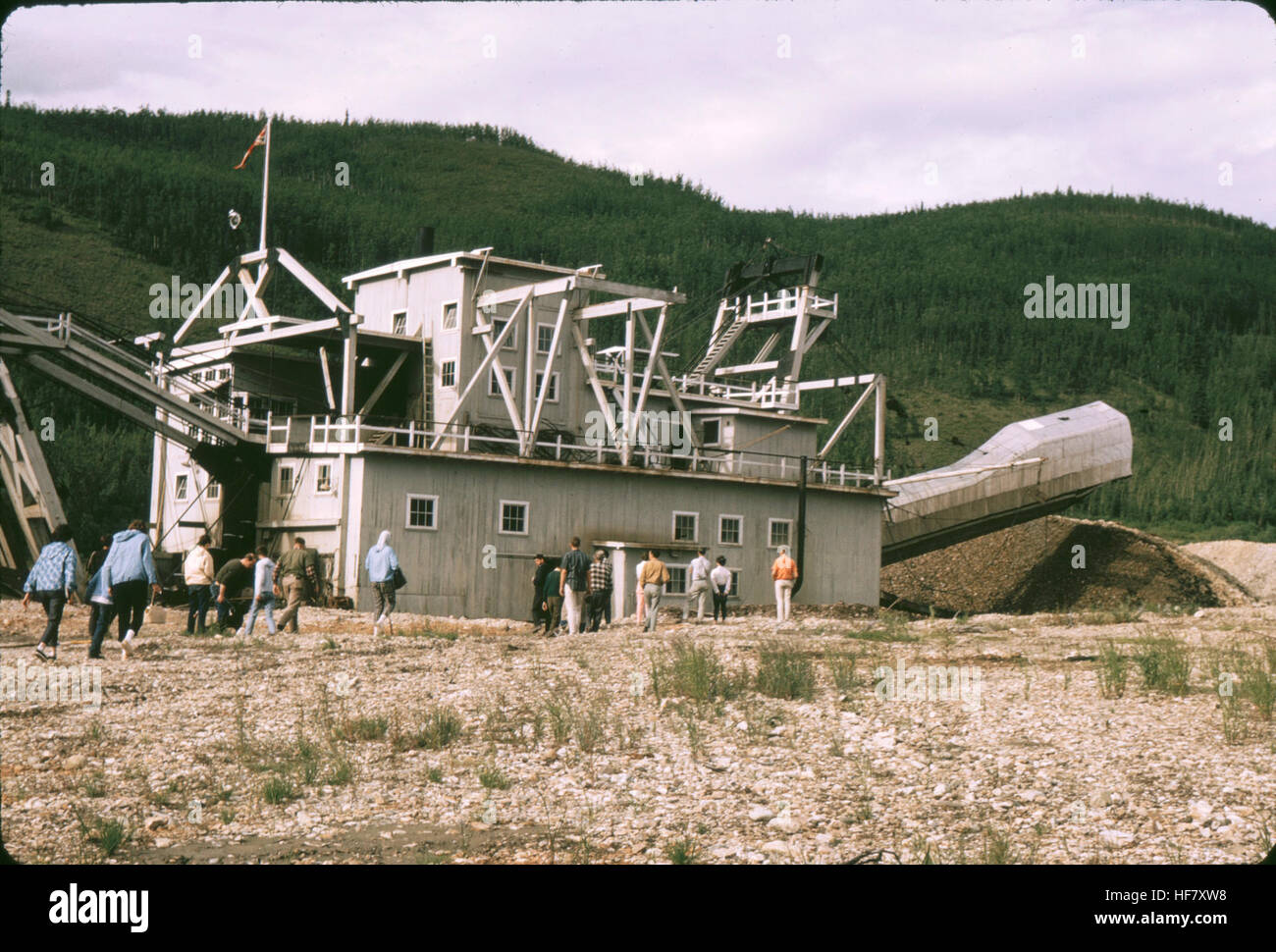 A photograph of a floating gold dredge in Dawson City, Yukon Territory ...