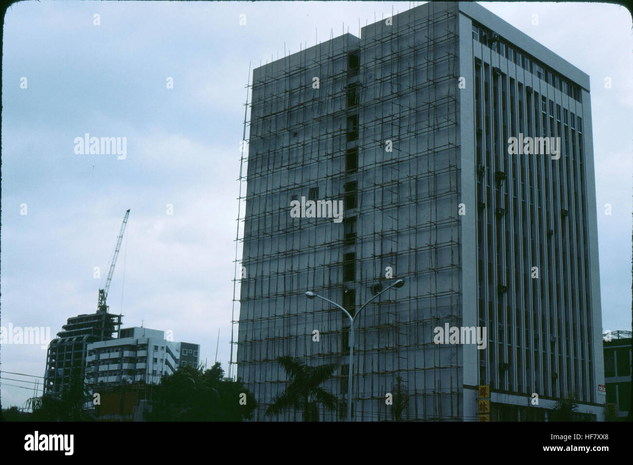 A high-rise building under construction in Taipei, Taiwan, with bamboo ...