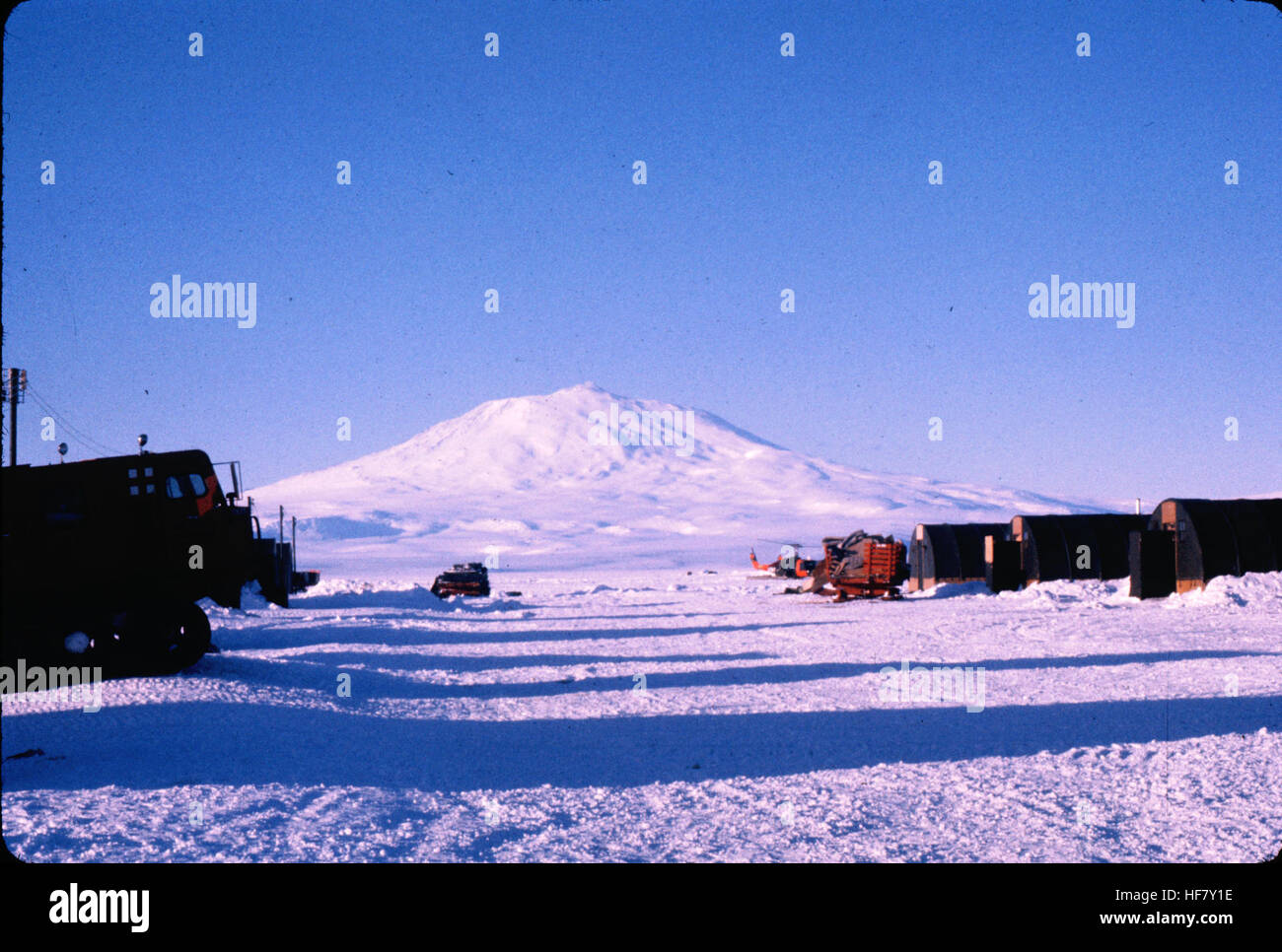 This photograph shows Mt. Erebus, an active volcano in Antarctica, as ...