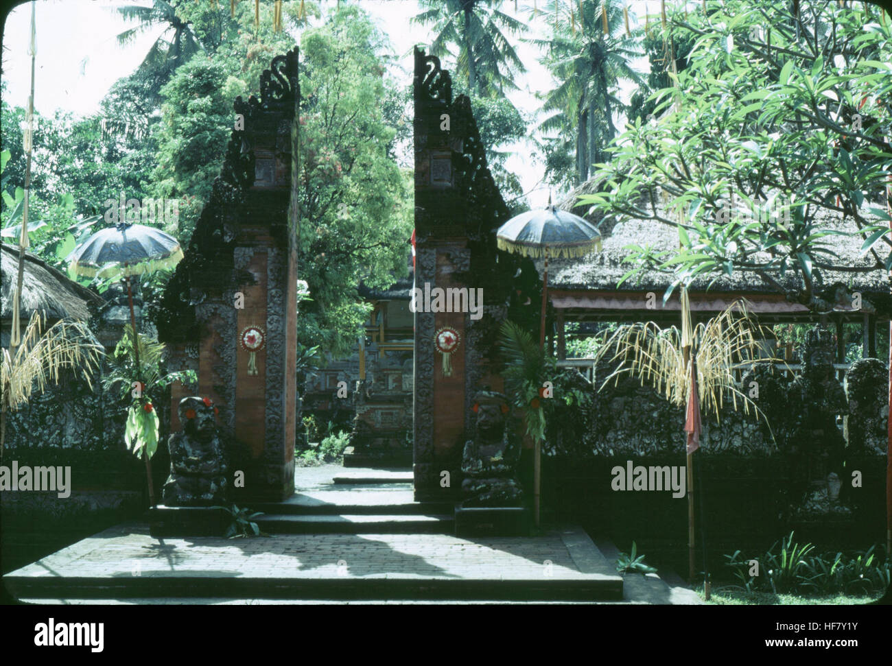 The split gate of an outdoor theater in Bali, Indonesia, is captured in ...