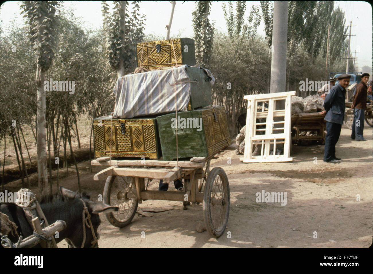 Donkey cart loaded with hope chests at open air bazaar; Kashgar ...