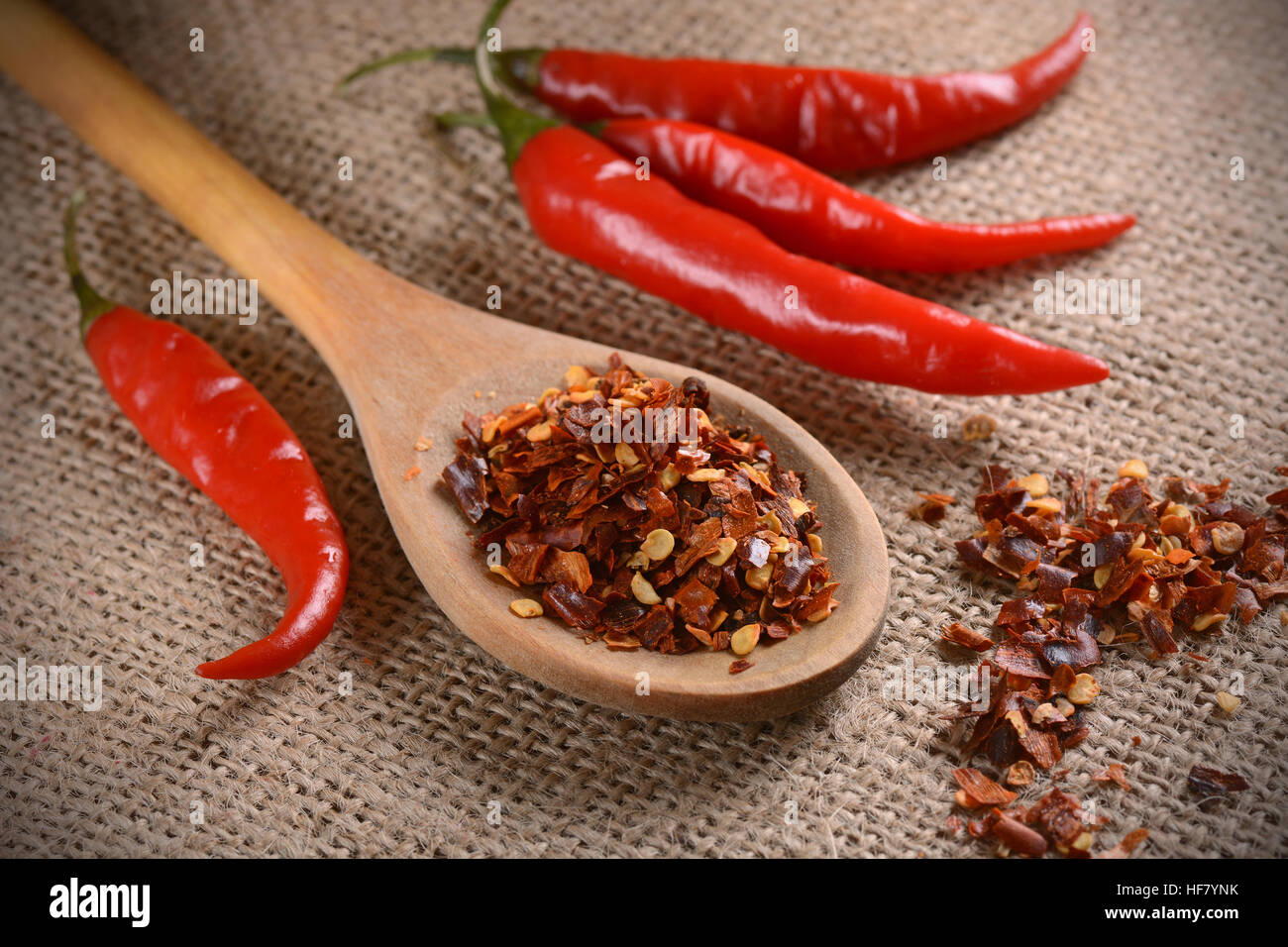 Red chili in wooden spoon hi-res stock photography and images - Alamy