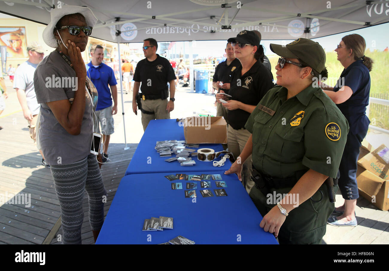 A visitor to a U.S. Customs and Border Protection recruiting booth asks ...