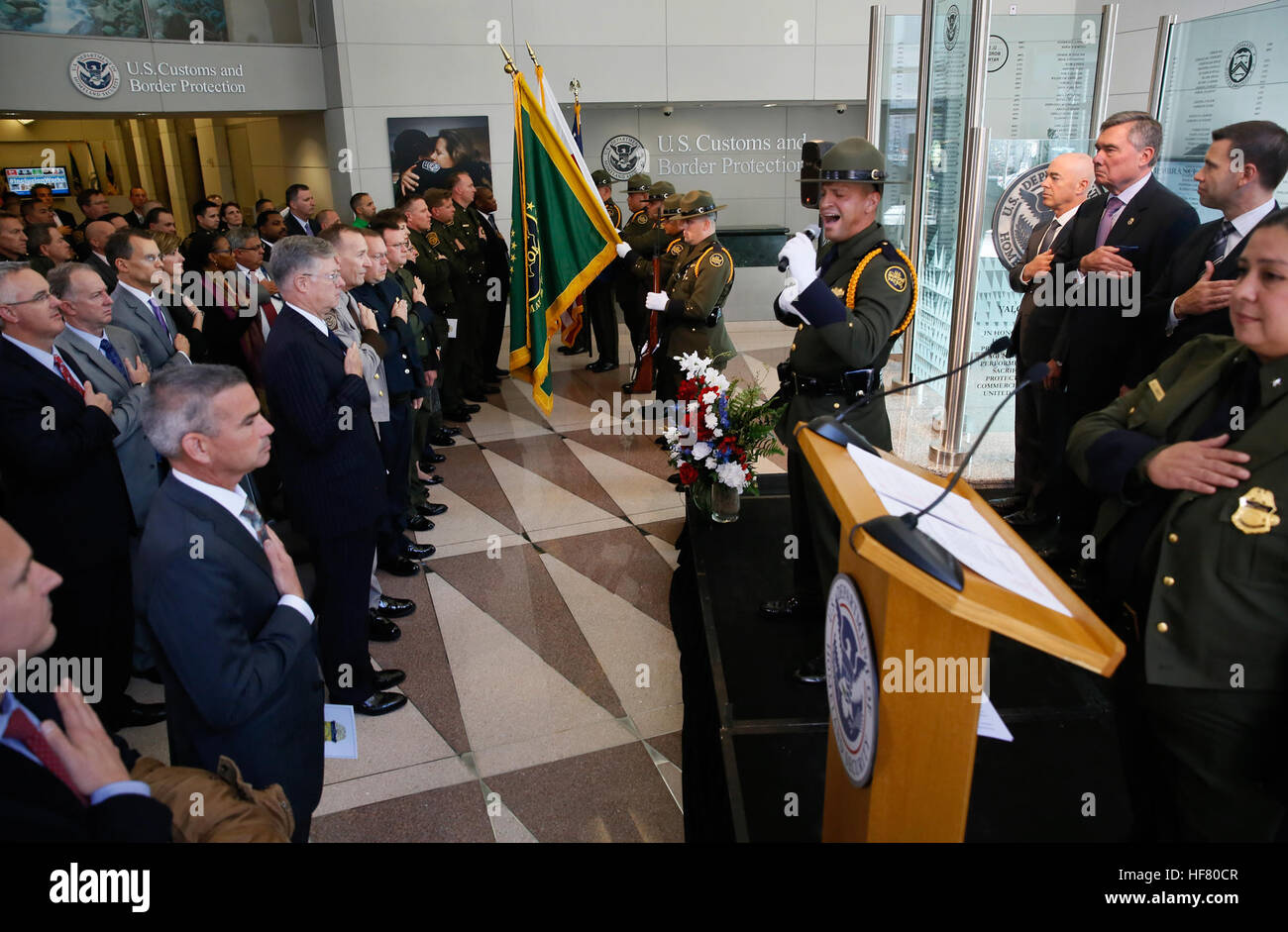 U.S. Border Patrol Agent Felix Carlo signs the National Anthem at the ...