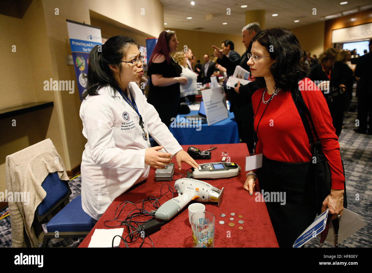 A member of the U.S. Customs and Border Protection crime lab talks with ...