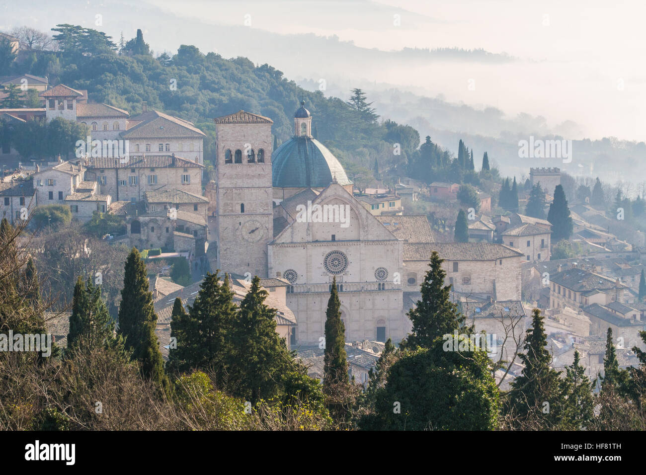 Assisi in the fog, and the Cathedral of San Rufino, Perugia province ...