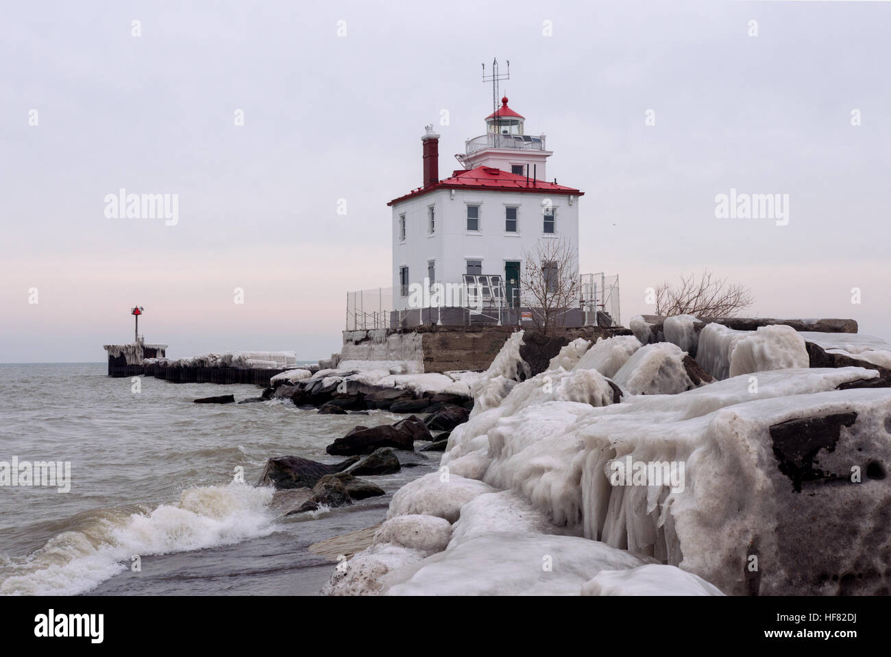 Lighthouse at Headlands Beach State Park near Cleveland, Ohio, covered ...